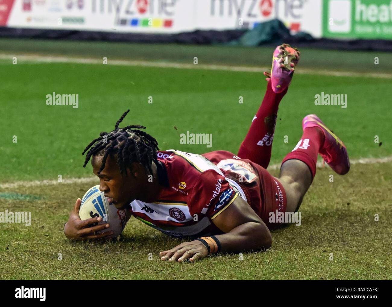 Wigan Warriors' Junior Nsemba scores his sides third try during the ...