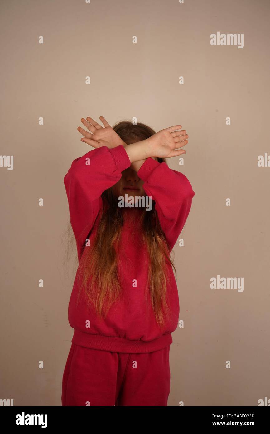 Her body language speaks of protection and distress, highlighting the ...