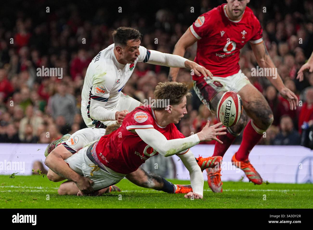 Cardiff, UK. 15th Mar, 2025. Ellis Mee of Wales offloads the ball during the 2025 Guinness 6 ...