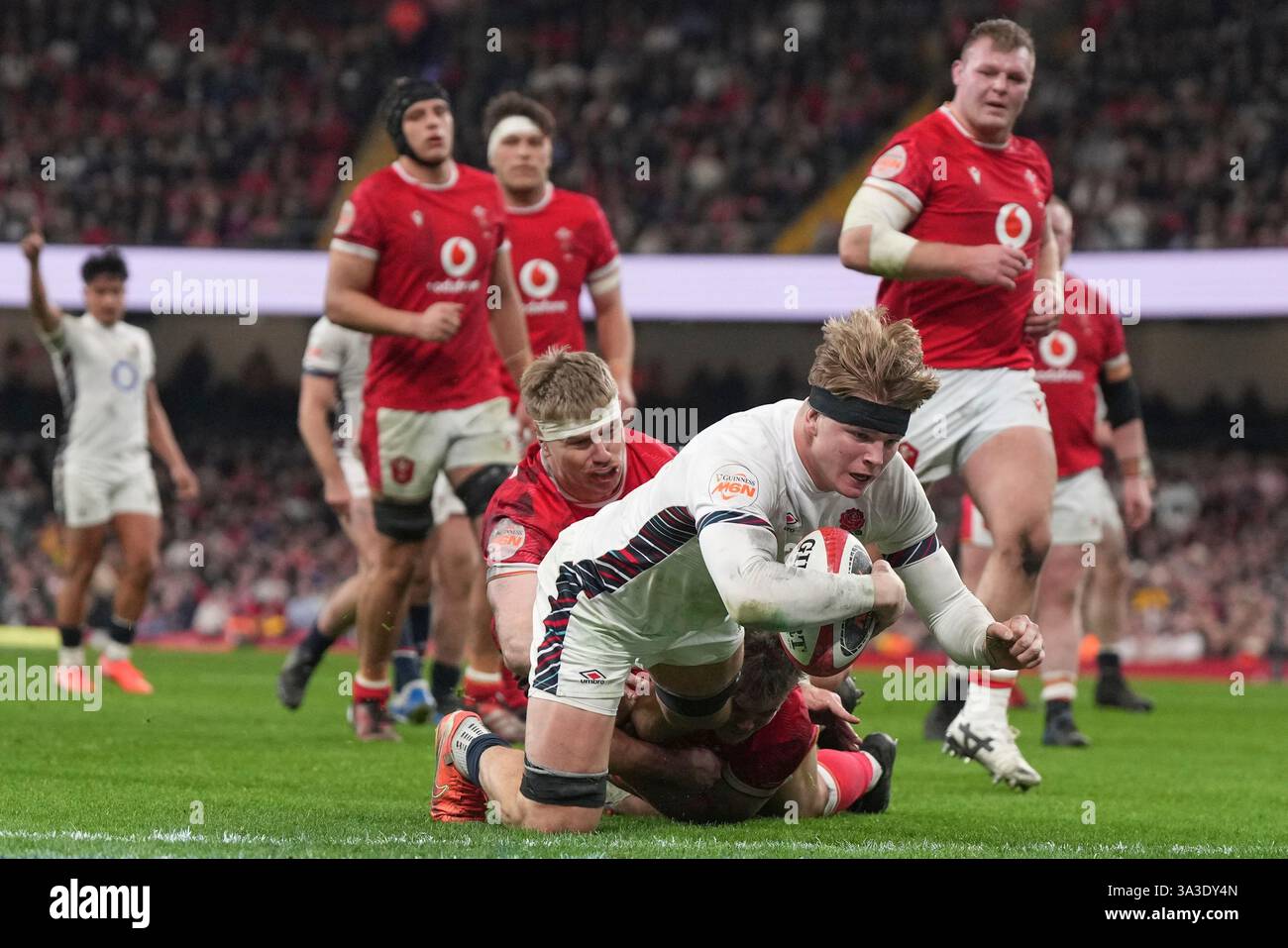 England's Henry Pollock crosses to score a try during the Six Nations ...