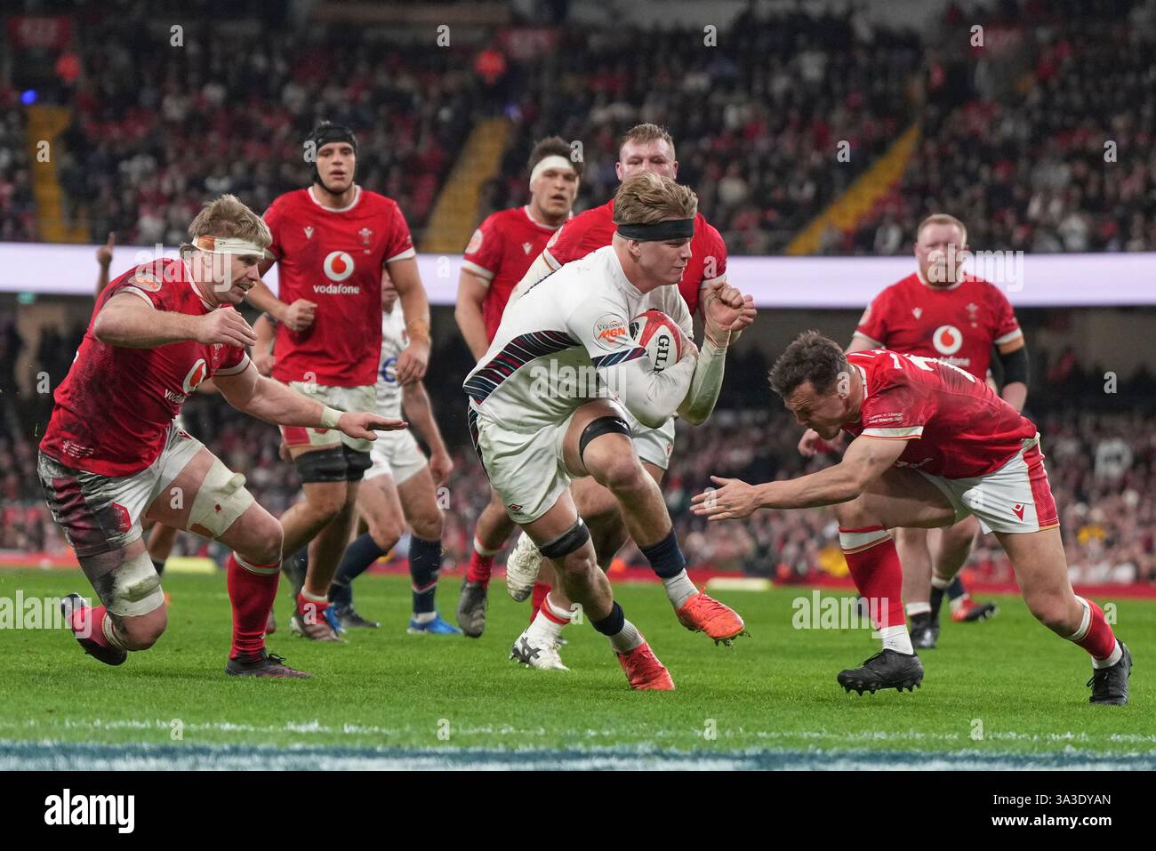 England's Henry Pollock crosses to score a try during the Six Nations ...