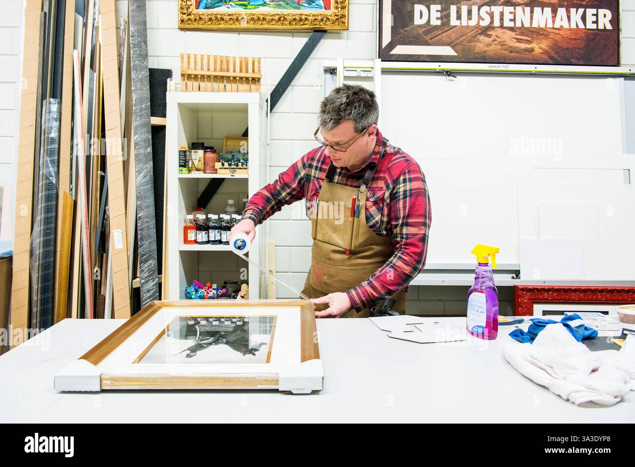 Framemaker inside his workshop Goirle, Netherlands. Mid adult male ...