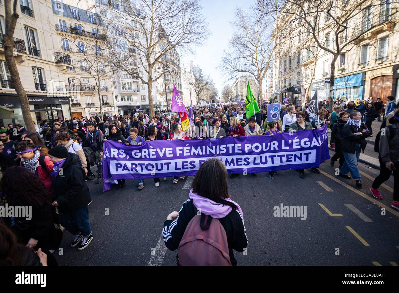 Paris, France. 8th Mar, 2025. Feminists demonstrators hold a banner ...