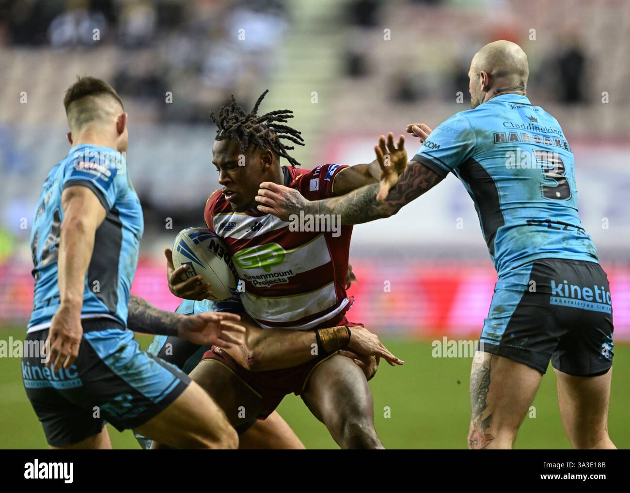 Wigan Warriors' Junior Nsemba is tackled during the Betfred Challenge ...