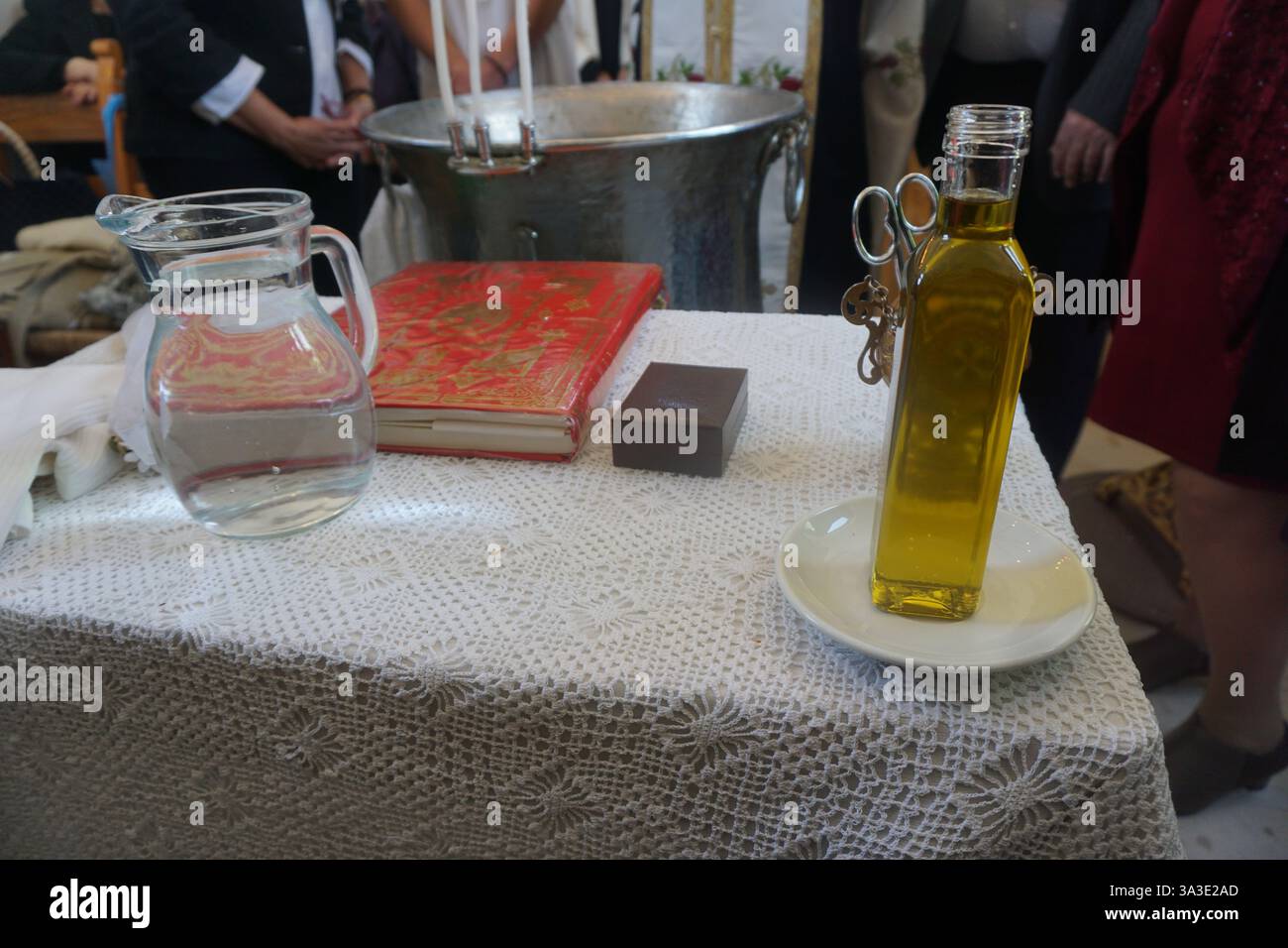 Everything ready on the table for the baptism: holy water, olive oil ...