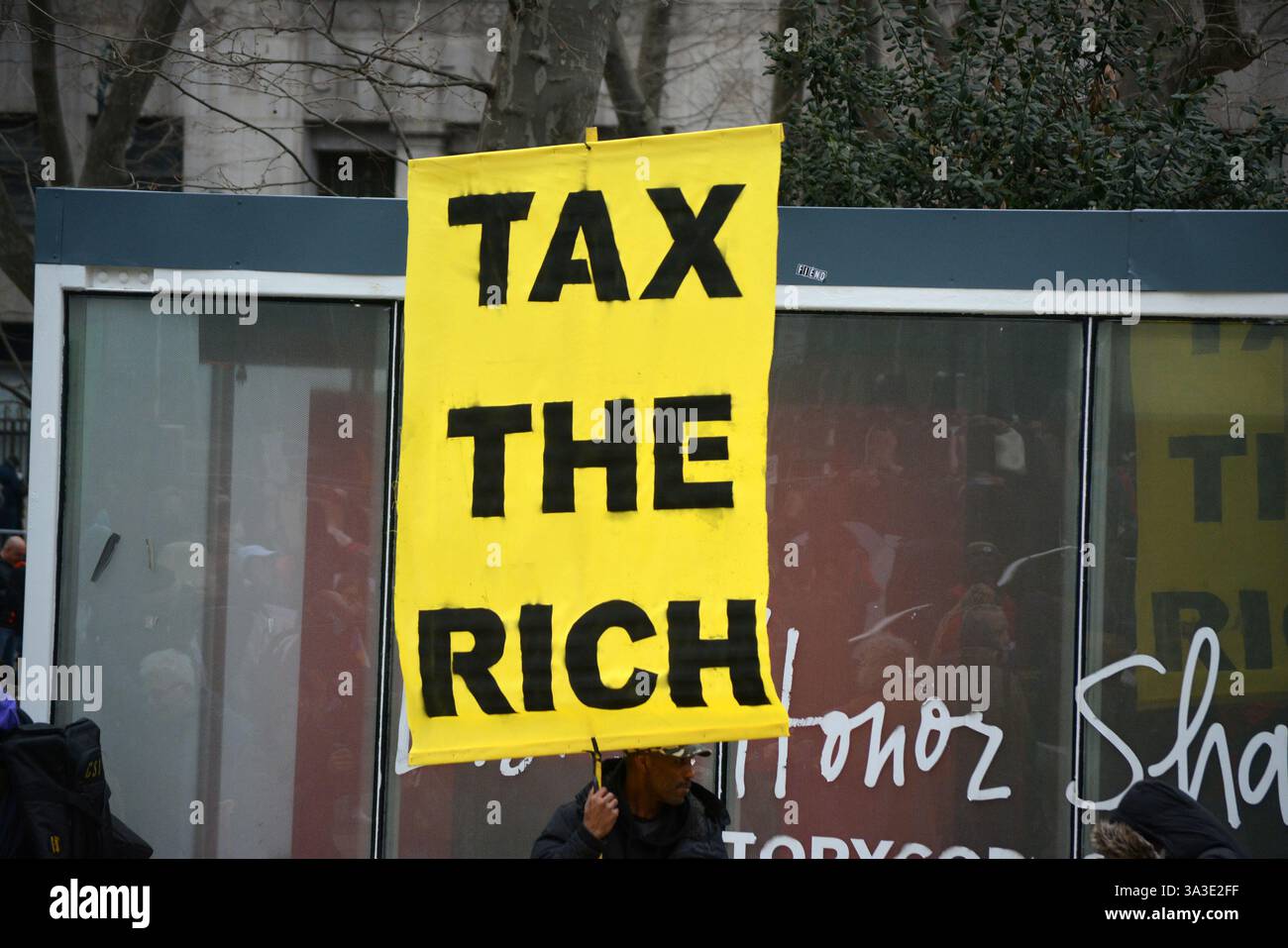 Sign at a Stop the Cuts rally against DOGE cuts to federal funding in ...