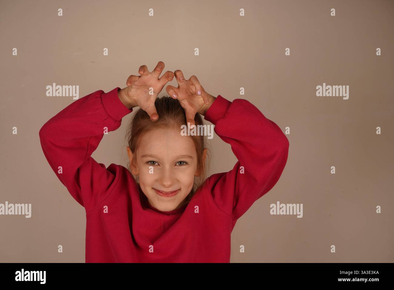 A charming portrayal of youthful creativity and humor. A cheerful girl ...