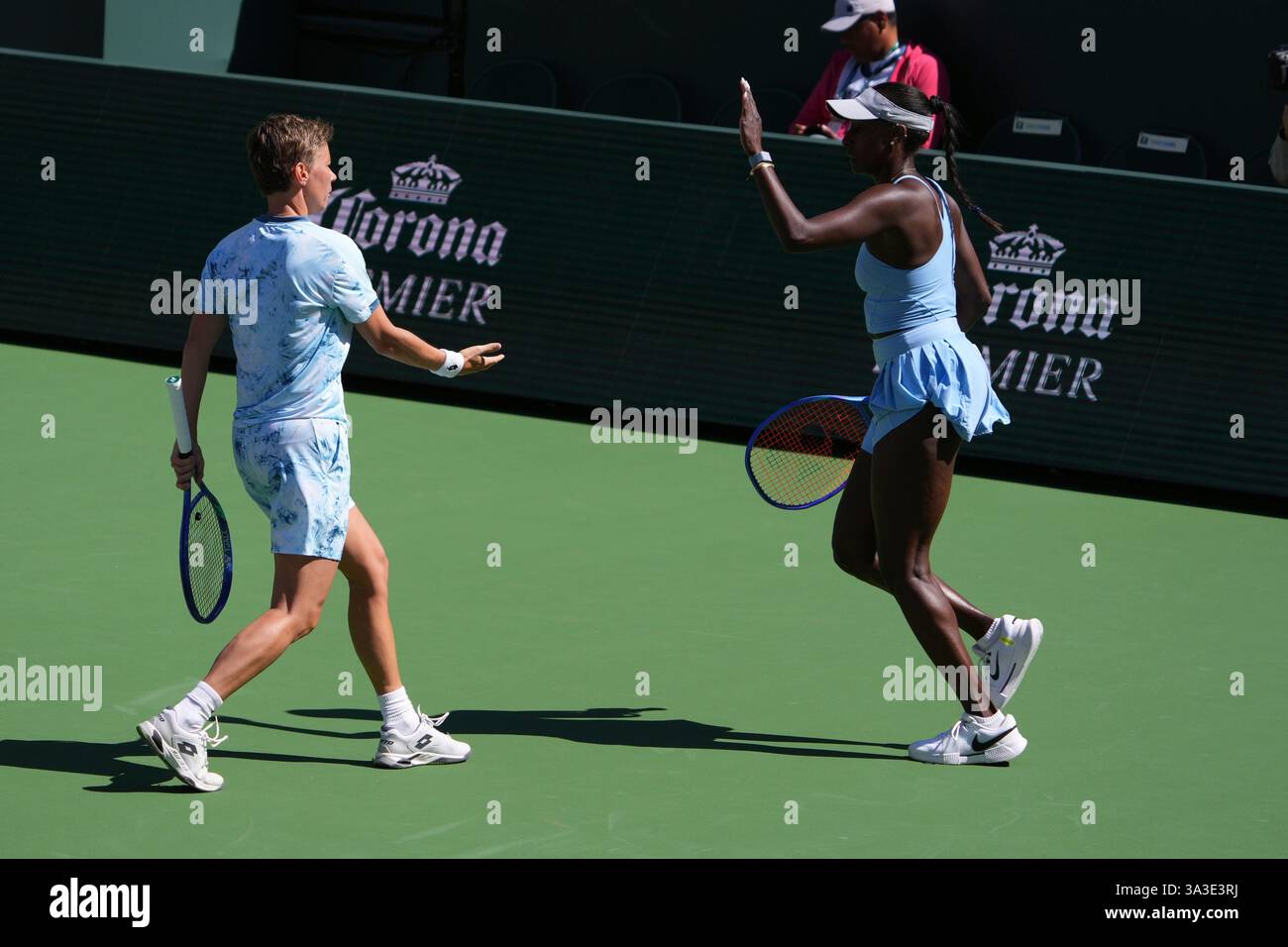 Asia Muhammad, of the United States, right, celebrates a point with ...