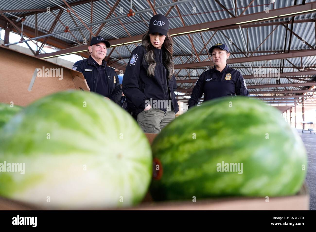 Homeland Security Secretary Kristi Noem, center, acting Port Director ...