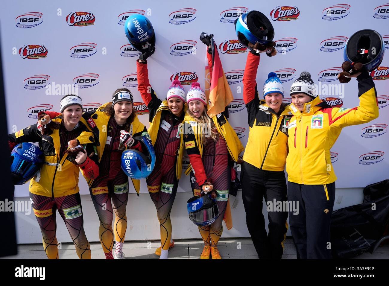 The German teams that won the top three spots in the 2-woman bobsled competition celebrate ...