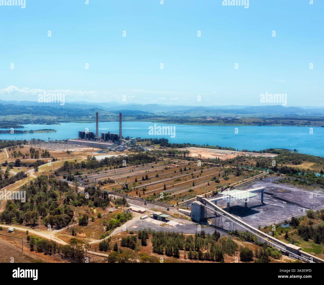 LJiddell power station on shores of Lake Lidell in Hunter valley of ...