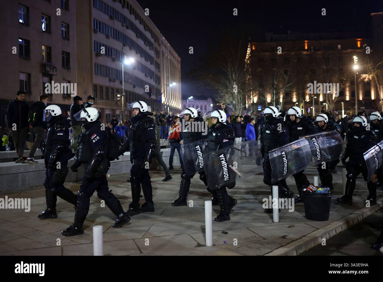 A group of anti-riot police moves during a major rally against populist ...