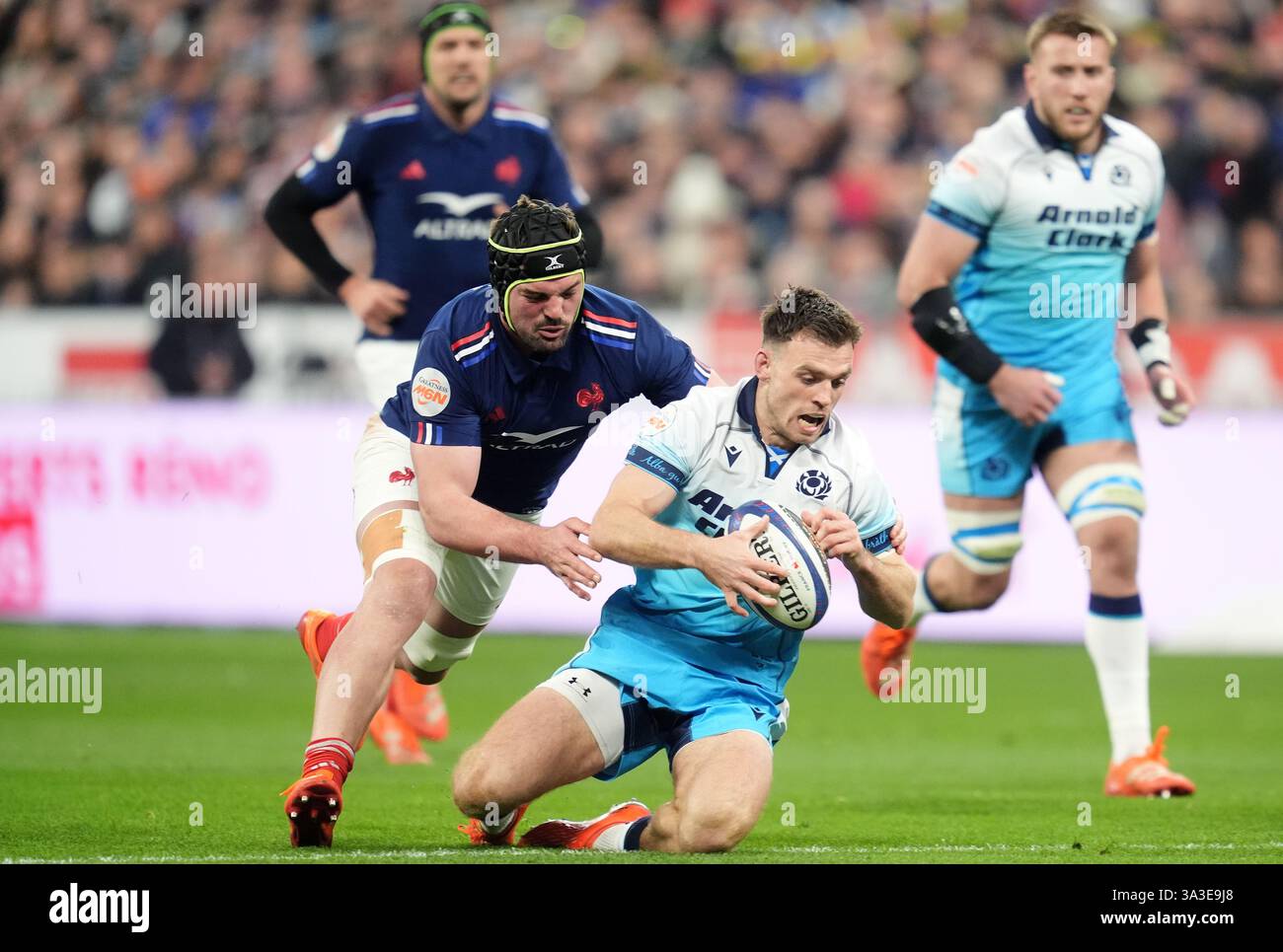 Scotland's Ben White (centre right) is tackled by France's Gregory ...
