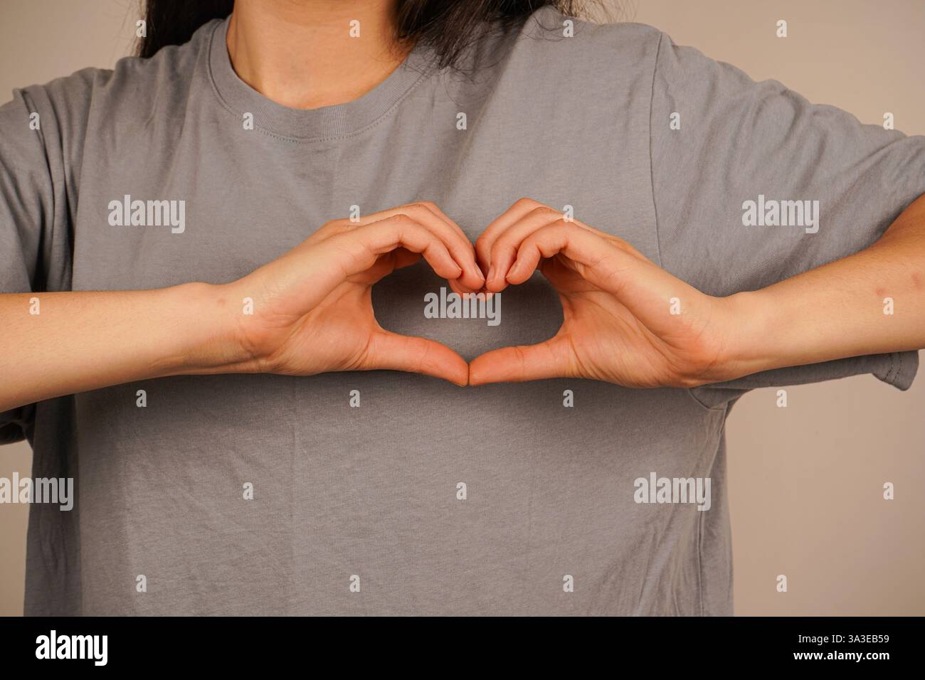 Two hands interlocked in the shape of a heart deliver a clear message ...