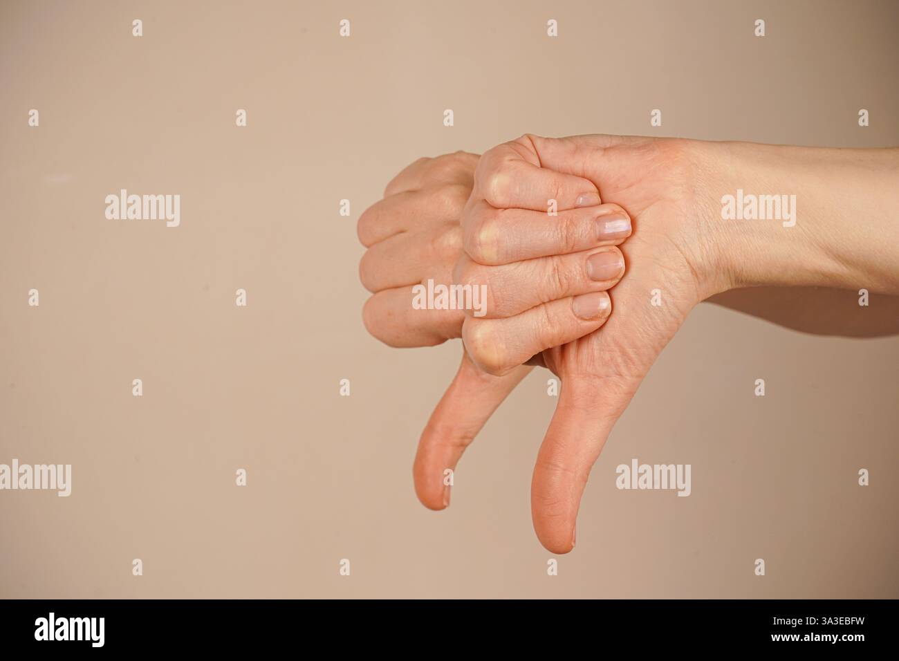 A simple gesture of pointing fingers down conveys a strong sense of ...