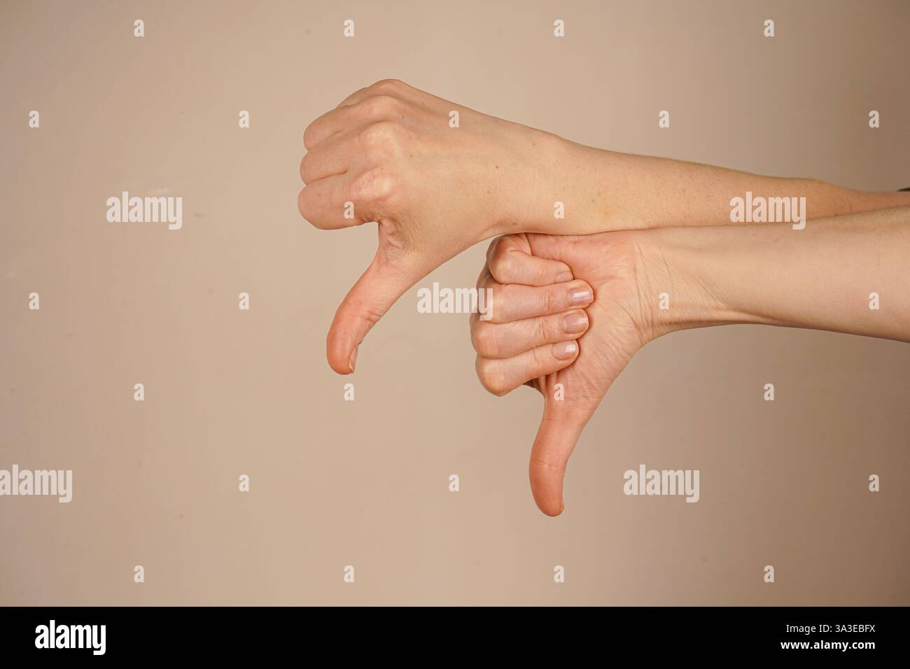 A simple gesture of pointing fingers down conveys a strong sense of ...