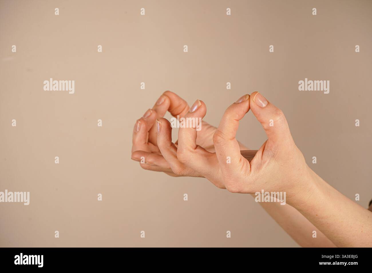 Two hands show gestures. Index finger and thumb pressed together ...