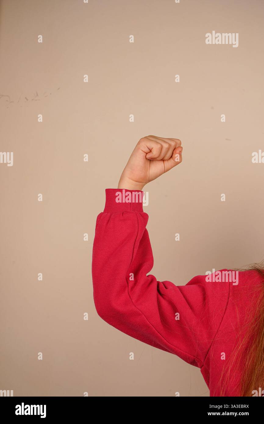 The powerful gesture conveys confidence and determination. The clean ...