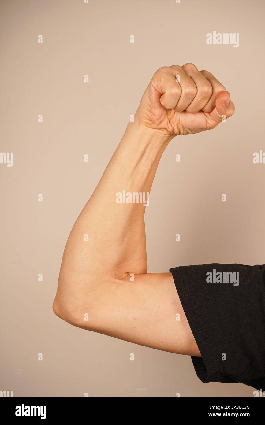 The powerful gesture conveys confidence and determination. The clean ...