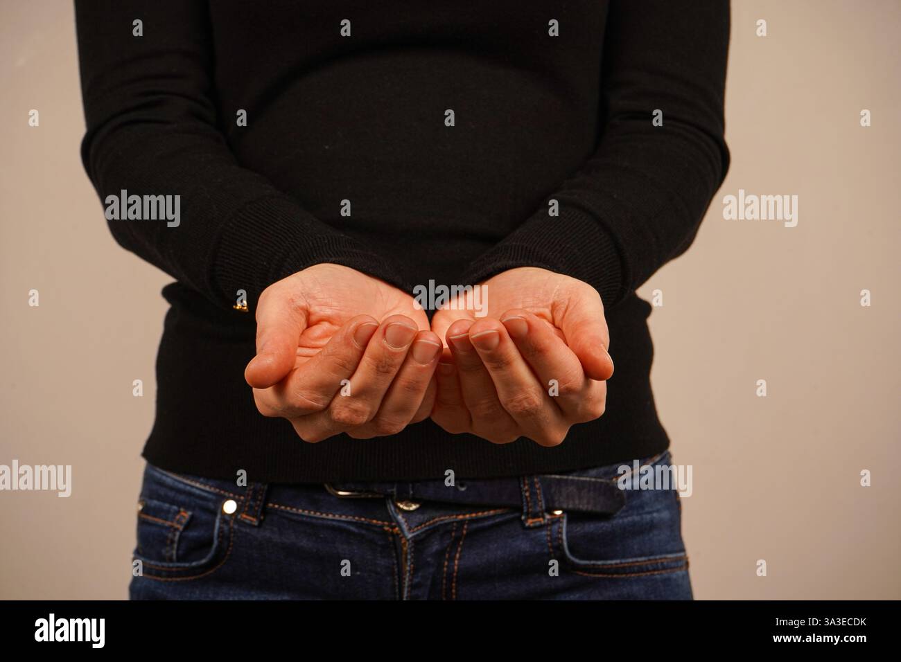 The two hands are pressed with their palms against the mountain. Two ...