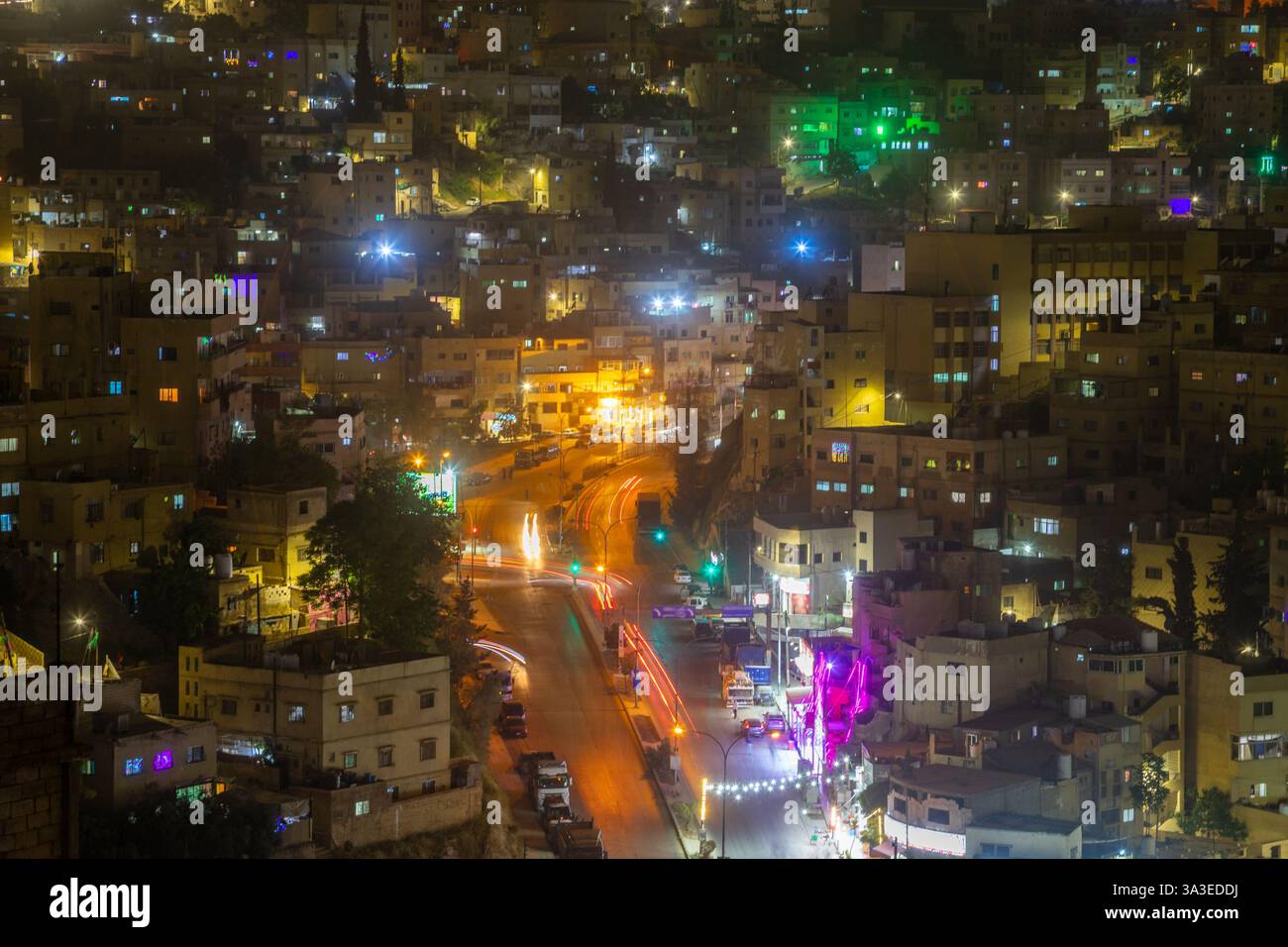 Nightlife panorama of Amman city downtown with lots of glowing streets ...