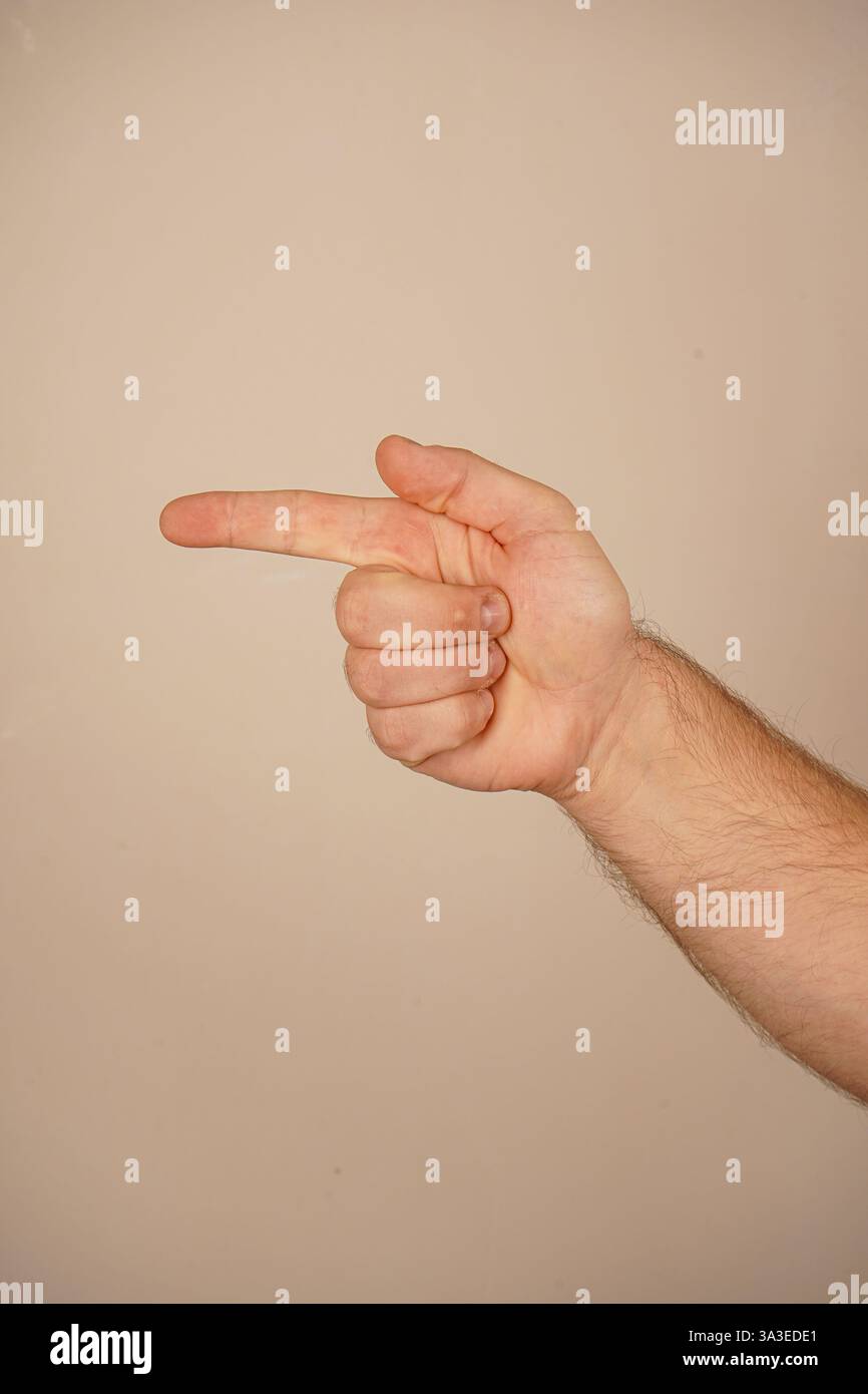 The index finger points forward with intent, drawing attention to ...