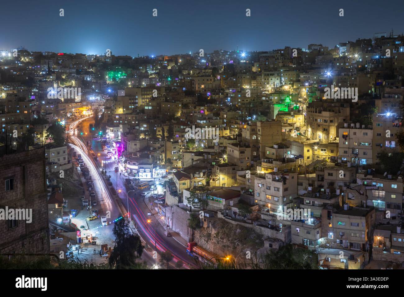 Night panorama of Amman city downtown with lots of glowing streets and ...
