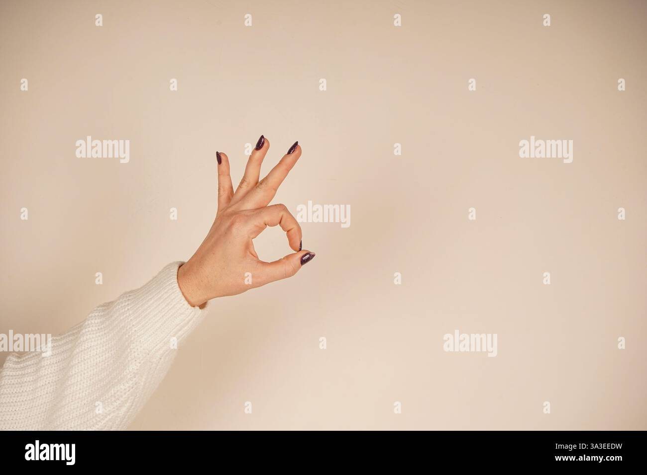 The gesture symbolizes agreement and approval. The thumb sign is easily ...