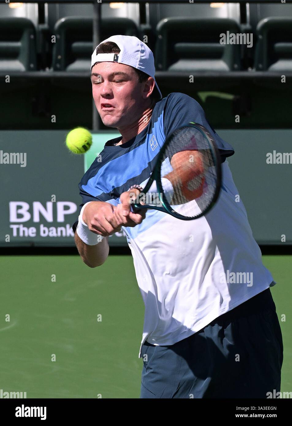 INDIAN WELLS, CA - MARCH 15: Jagger Leach (USA) returns the ball during ...