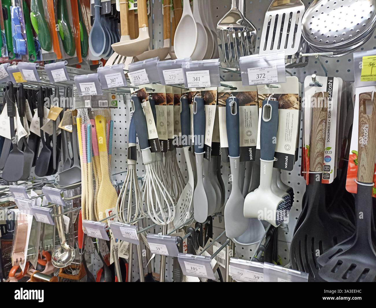Variety of kitchen utensils on display in store aisle Stock Photo - Alamy