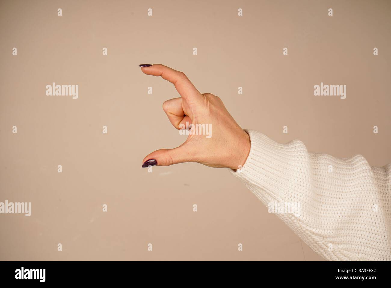 Hand gesture where thumb and index finger form a small gap. Concept ...