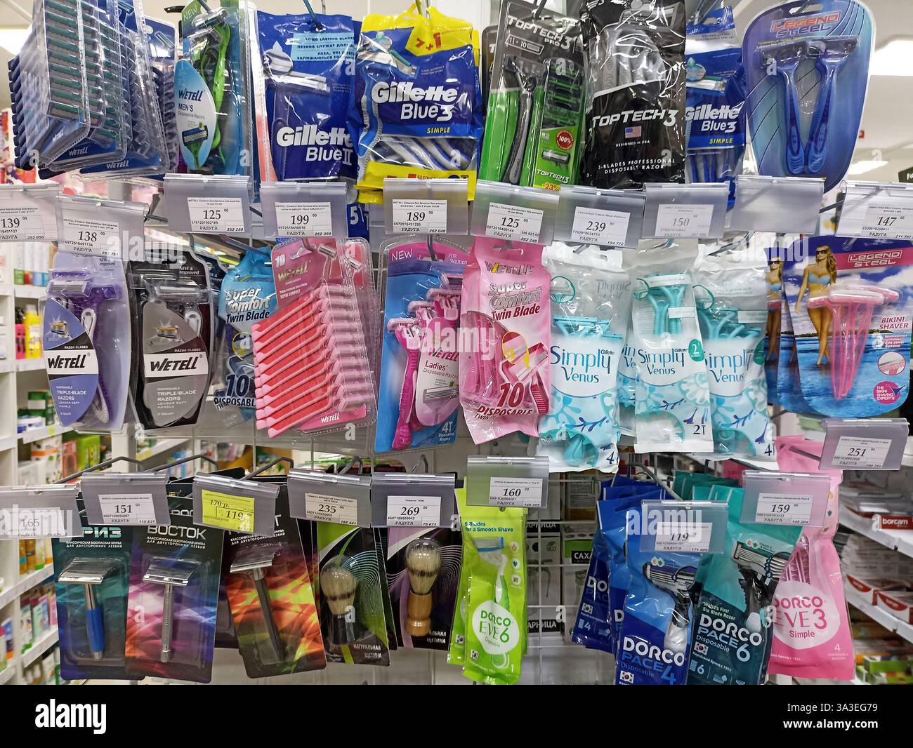 Assorted razors and blades display in store aisle Stock Photo - Alamy