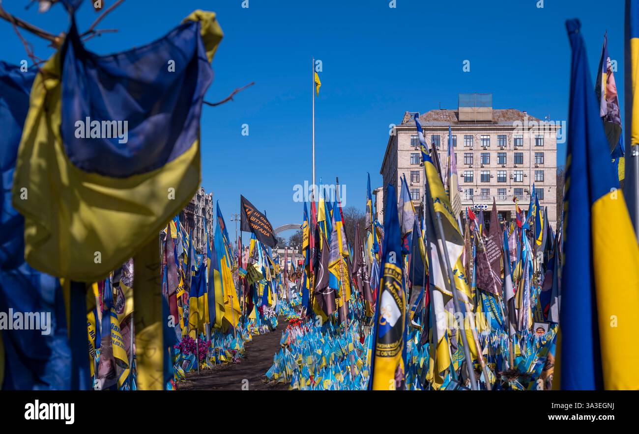 Kyiv, Ukraine - 14th March, 2025. A vibrant memorial displays flags as ...