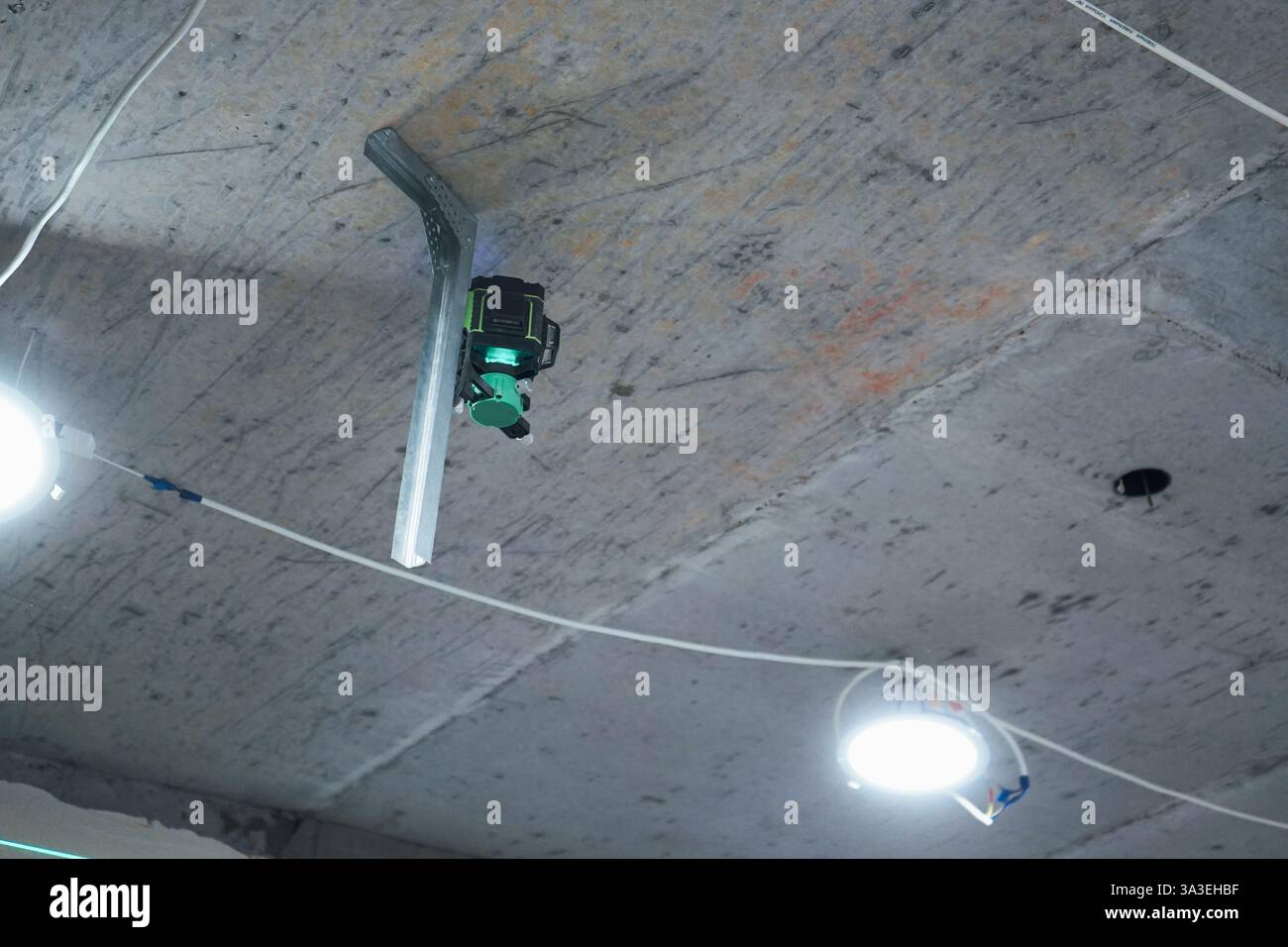 Construction laser level in a house under construction. Laser equipment ...