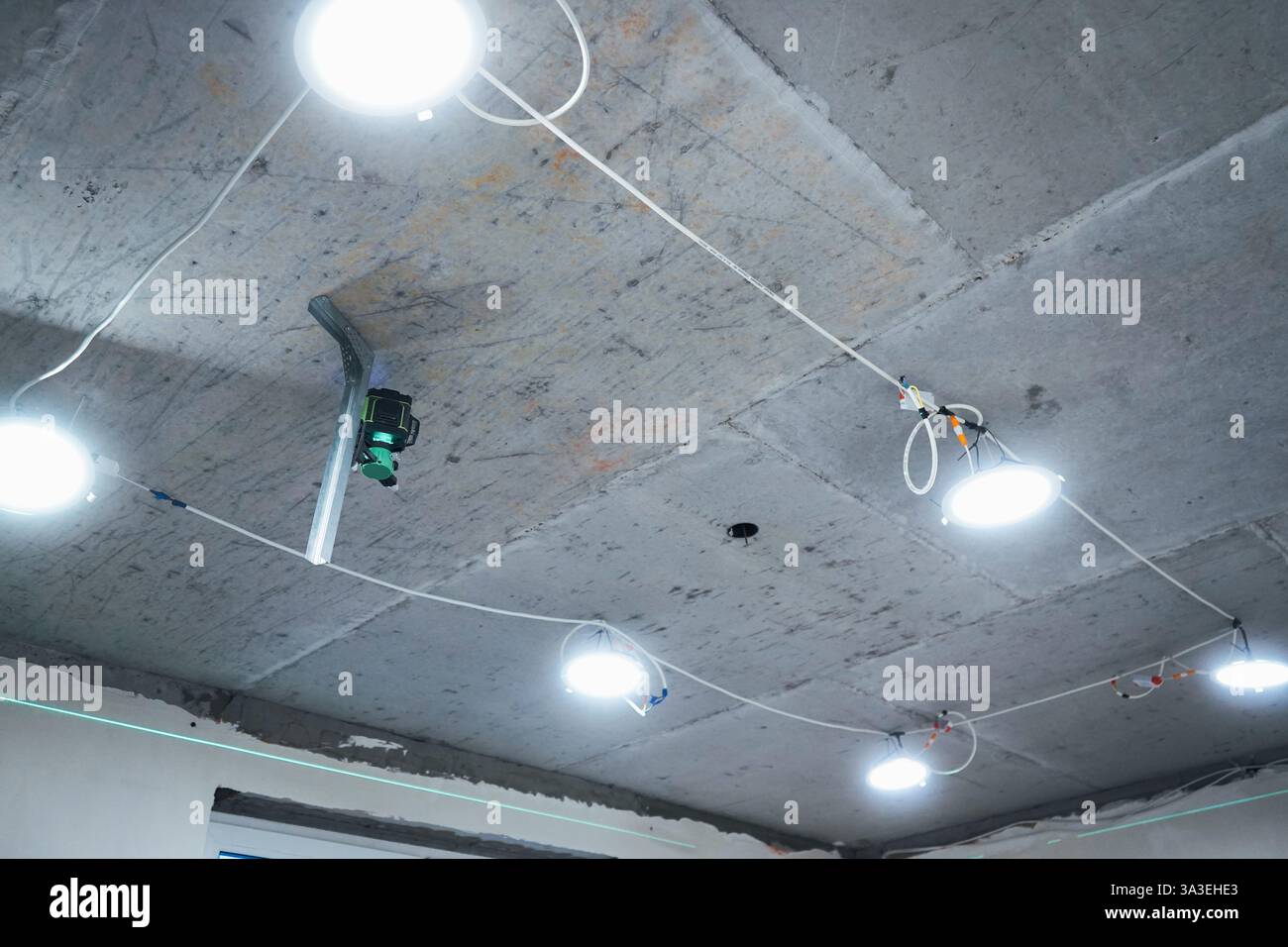 Laser level marks lines for marking at construction site ...