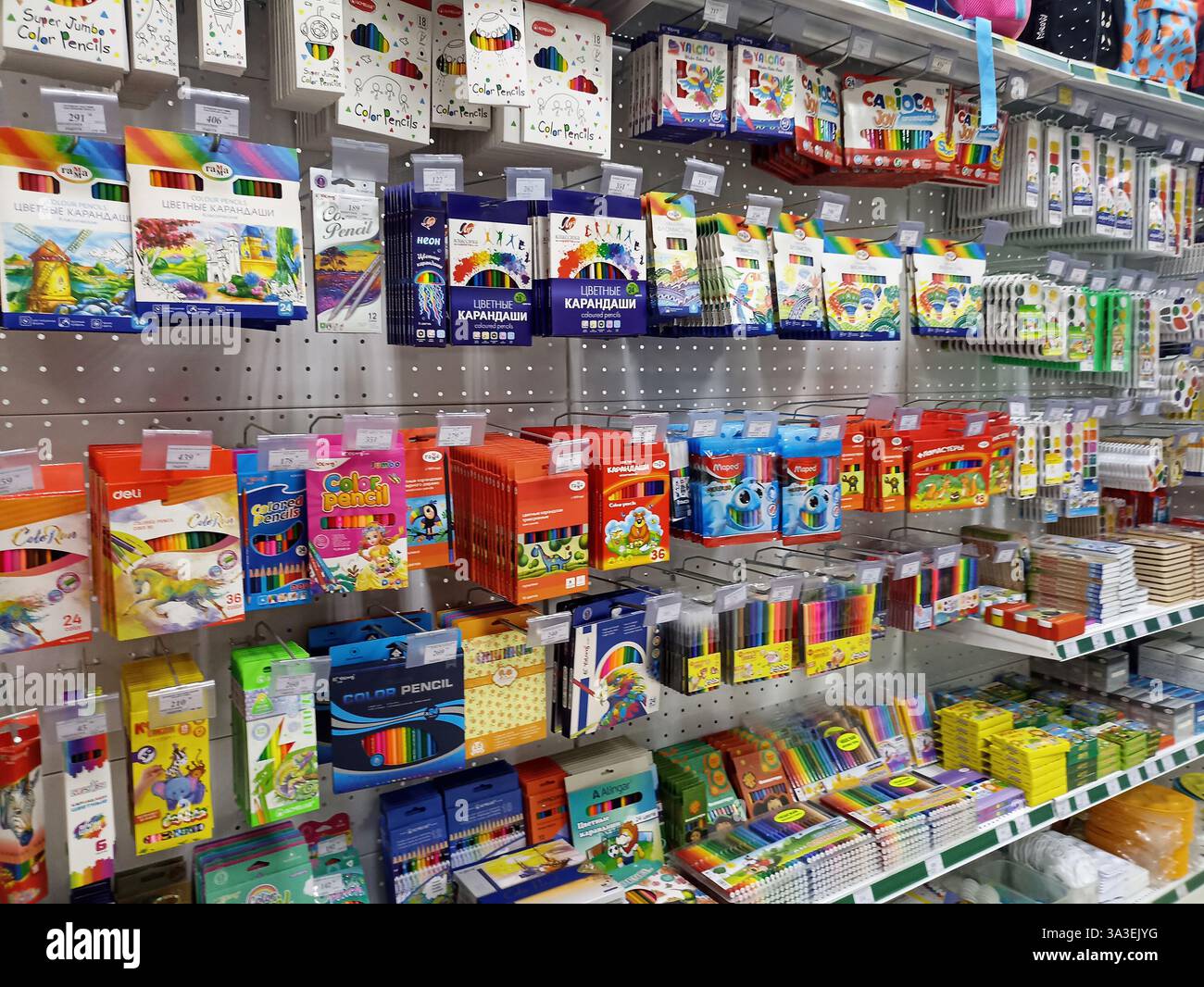 Colorful art supplies display on shelves in store aisle featuring ...
