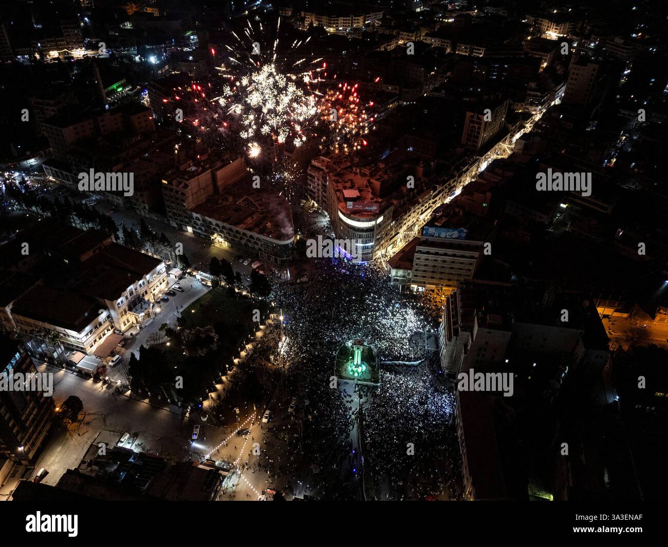 Homs, Syria. 15th Mar, 2025. Syrians gather at Tahrir Square (formerly ...