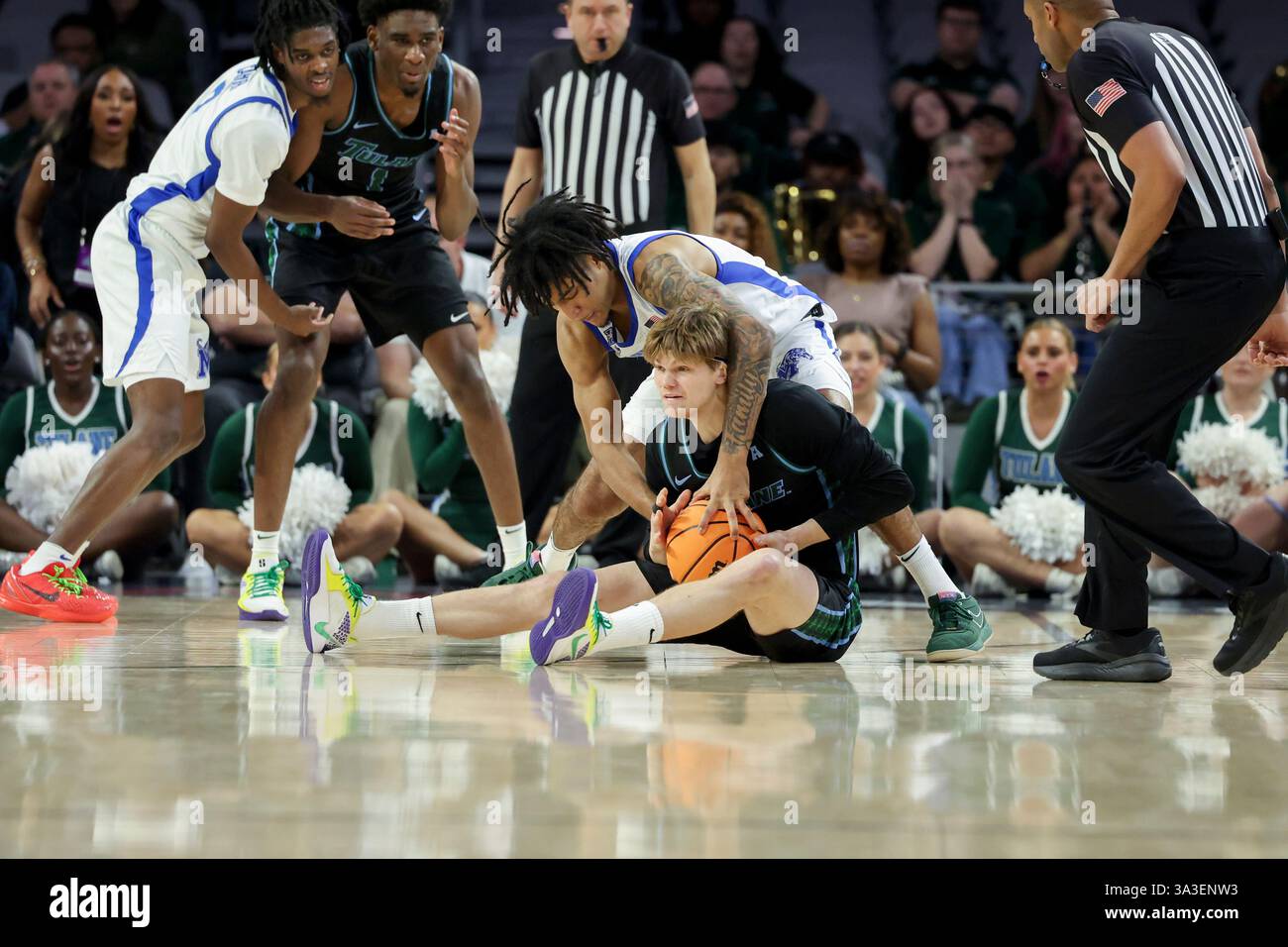Memphis guard PJ Haggerty, top, and Tulane guard Rowan Brumbaugh ...