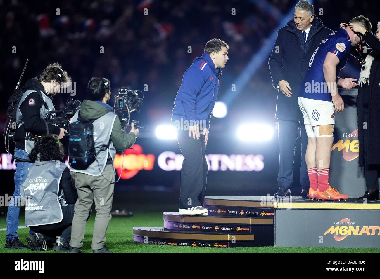 France's Antoine Dupont waits to receive his Guinness Men's Six Nations winners medal after the ...
