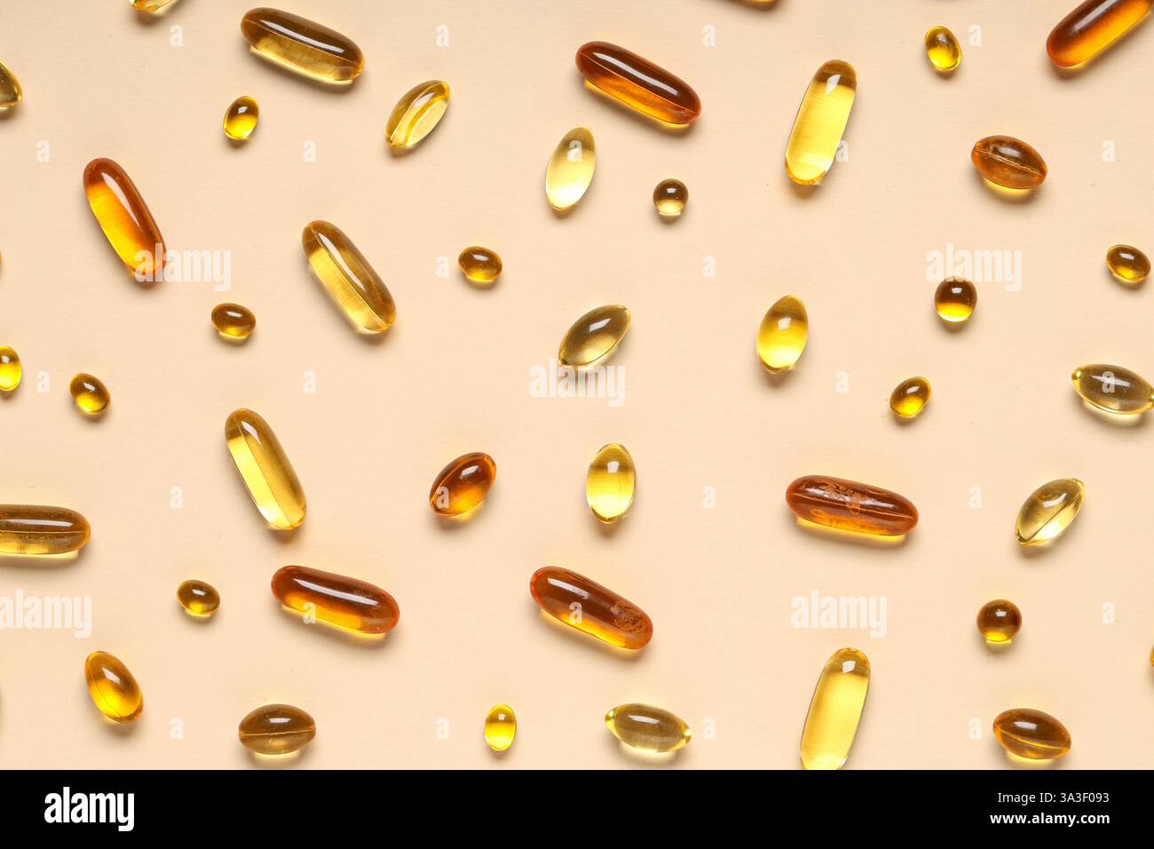 Composition with different fish oil capsules on color background Stock ...