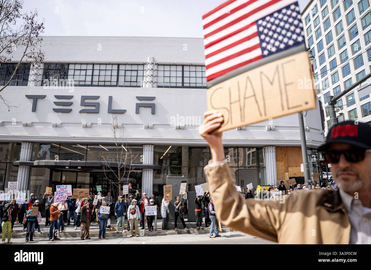 Protesters rally outside a Tesla dealership in San Francisco, Saturday ...