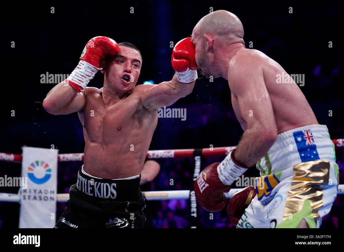 Nick Ball (left) defending his Featherweight WBA title against TJ ...