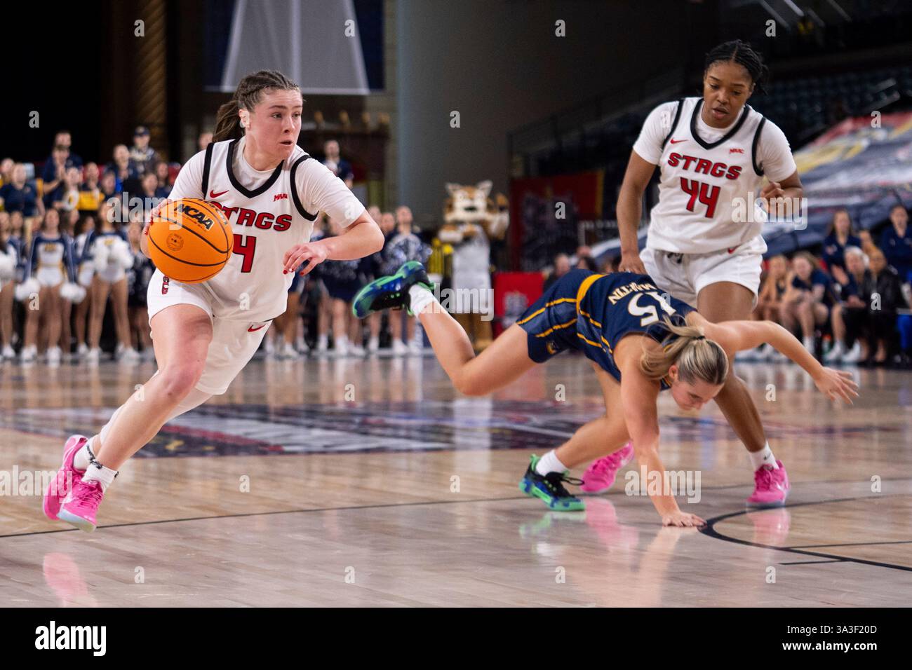 Fairfield's Kaety L'Amoreaux, left, drives to the basket as she uses ...