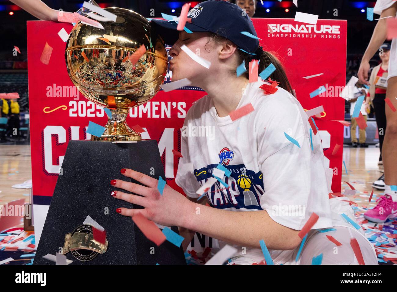 Fairfield's Kaety L'Amoreaux kisses the MAAC trophy following the NCAA college basketball game ...