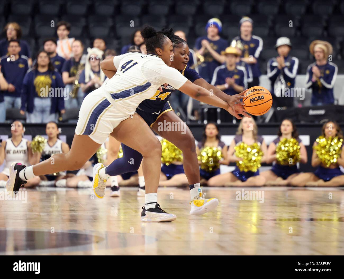 UC Davis guard Bria Shine (41) and UC San Diego forward Kayanna Spriggs ...