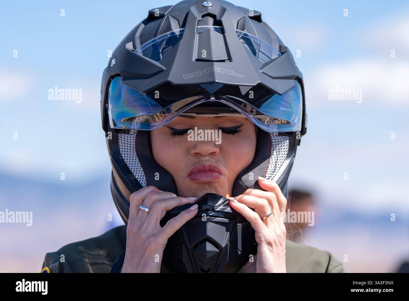 Homeland Security Secretary Kristi Noem puts on her helmet before she ...