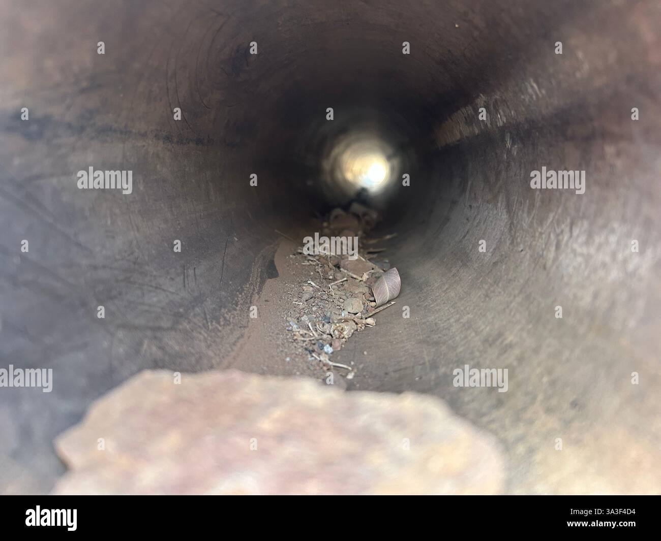 Close-up looking down a metal pipe Stock Photo - Alamy