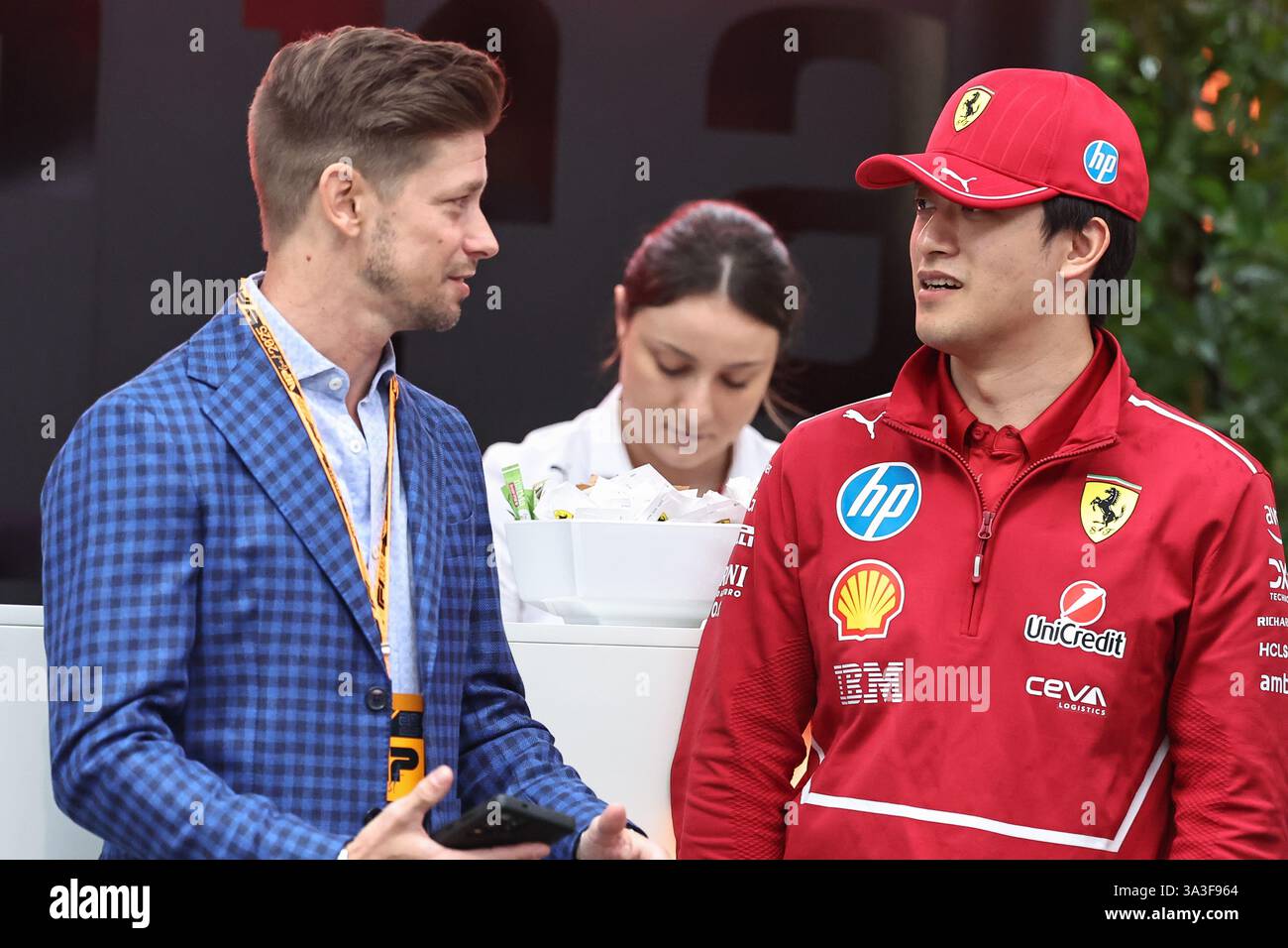 MELBOURNE, AUSTRALIA - MARCH 16: Casey Stoner talks with Zhou Guanyu of ...