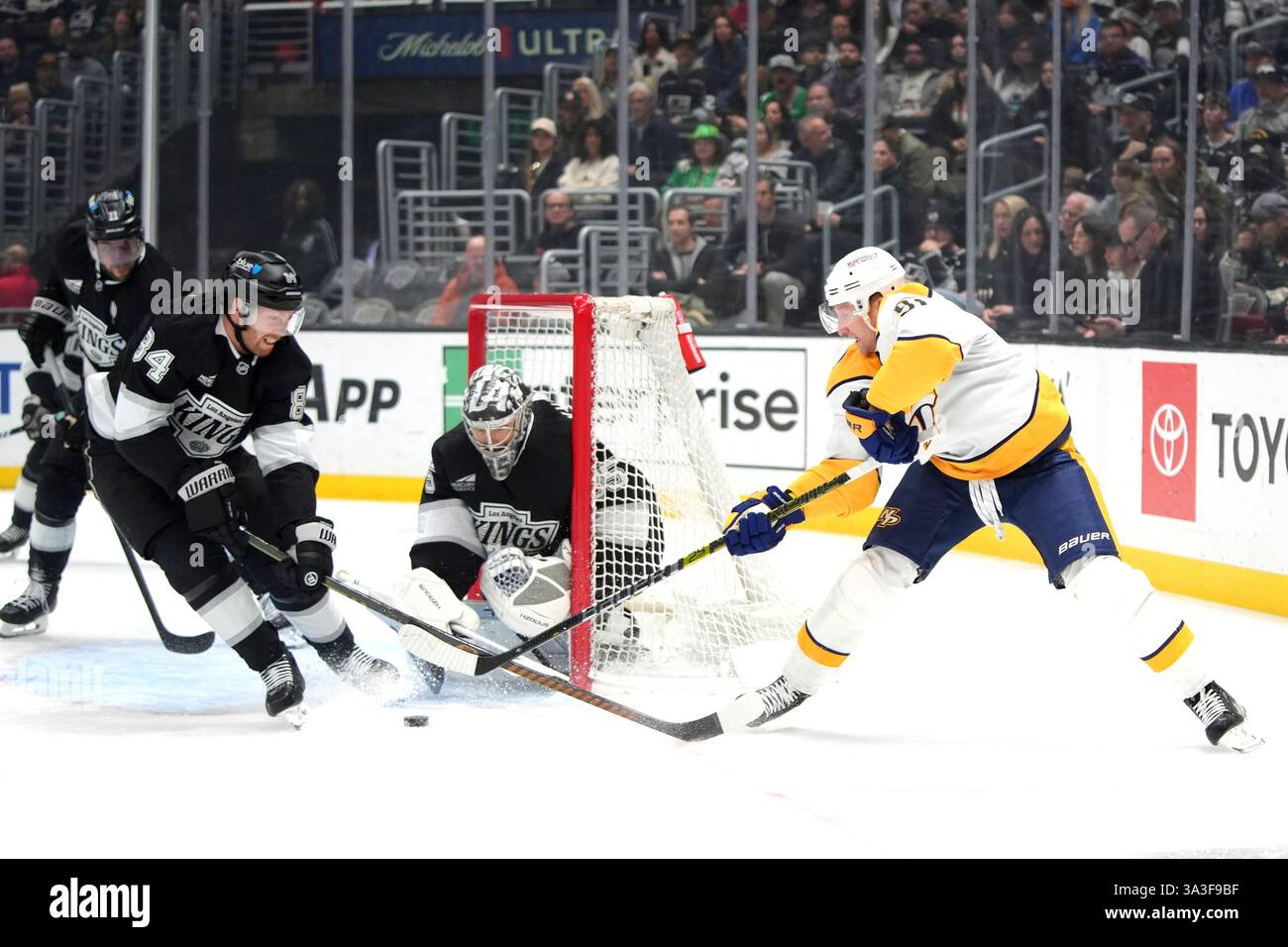 Nashville Predators center Steven Stamkos (91) is defended by Los ...