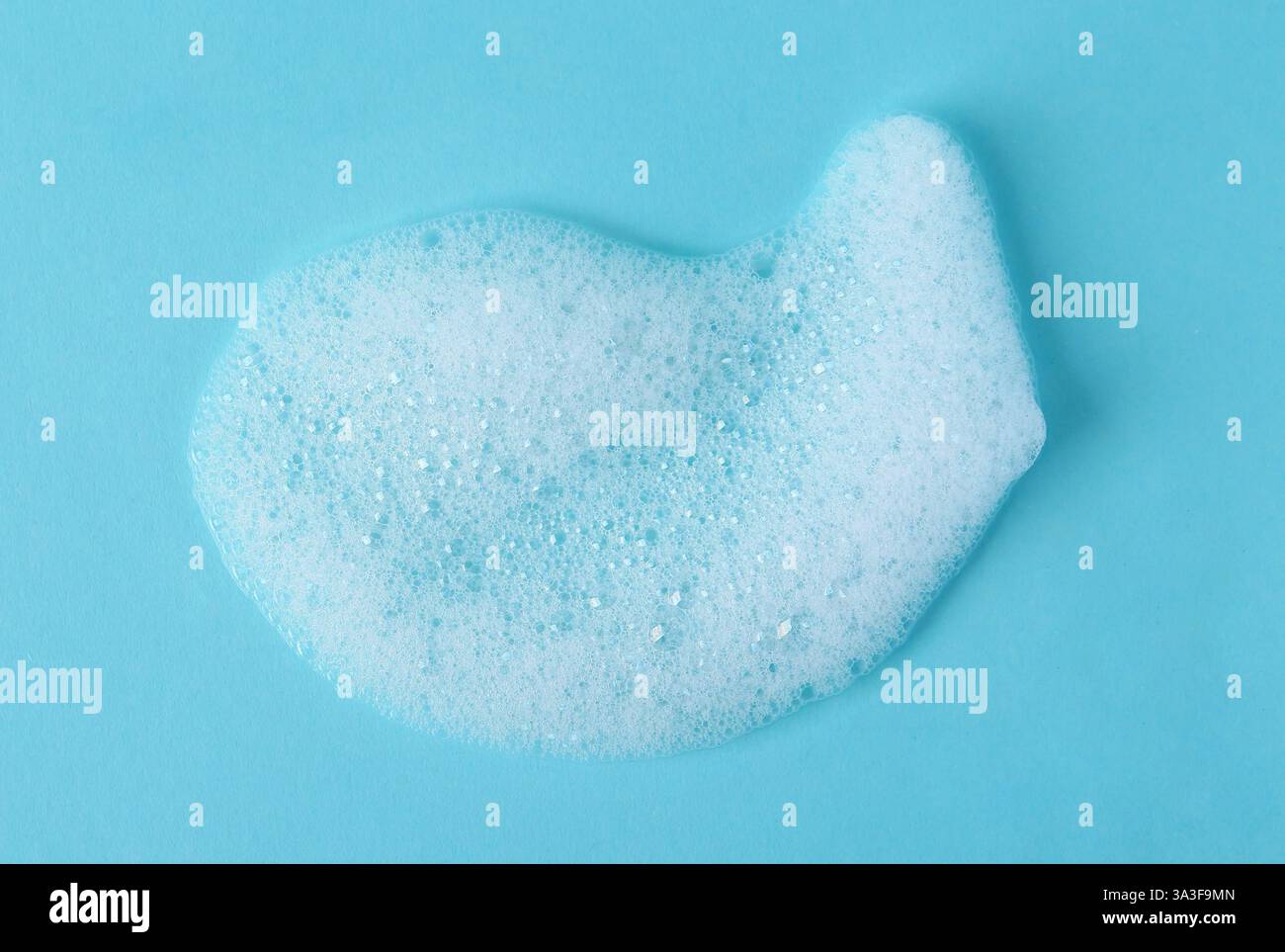 Sample of fluffy foam on light blue background, top view Stock Photo ...